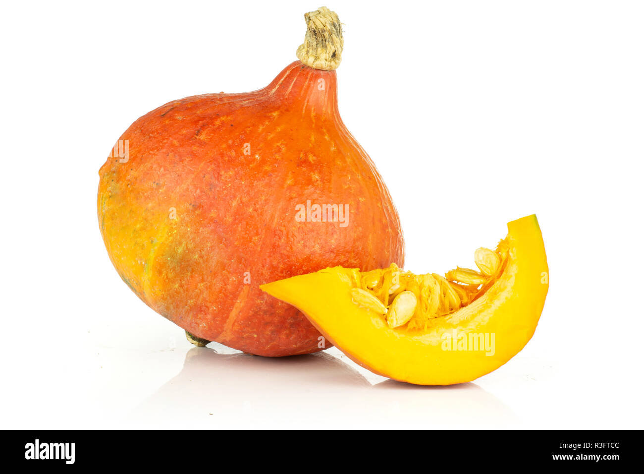 Group of one whole one slice of fresh red kuri pumpkin hokkaido variety ...