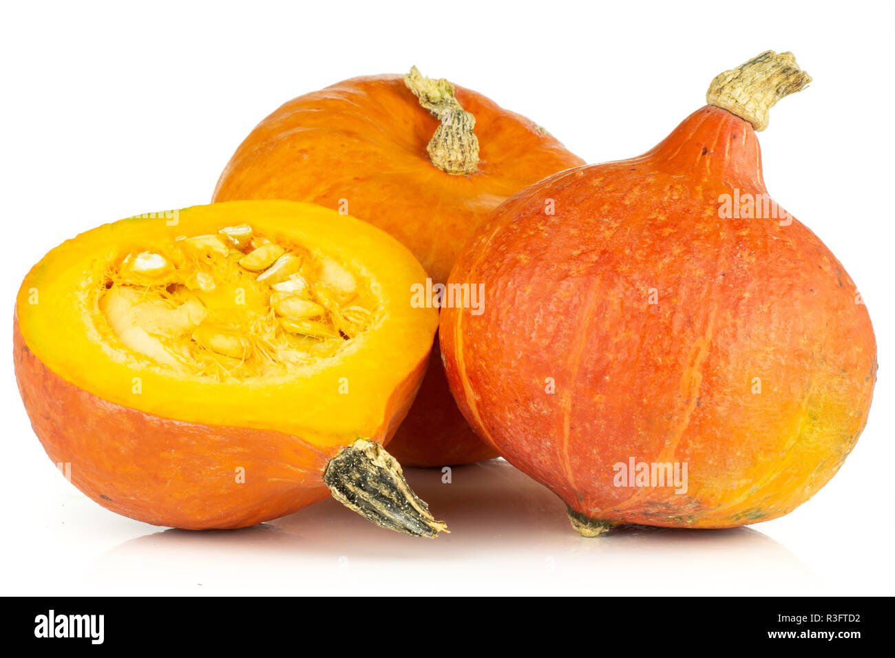 Group of two whole one half of raw fresh red kuri pumpkin hokkaido ...