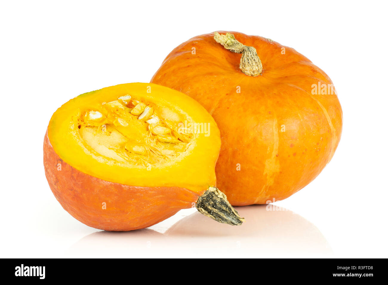 Group of one whole one half of fresh red kuri pumpkin hokkaido variety ...