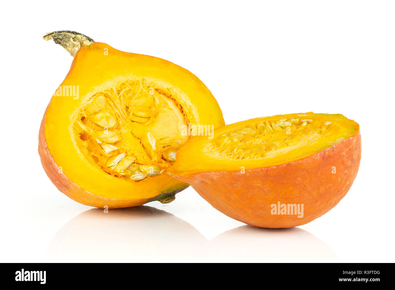 Group of two halves of fresh red kuri pumpkin hokkaido variety one cut ...