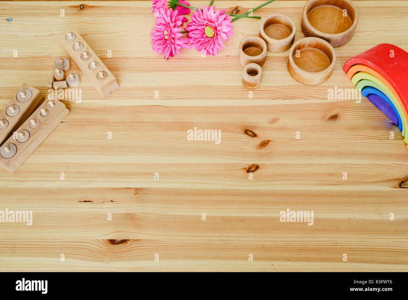 Group of learning materials of round and wooden colors on wooden table ...