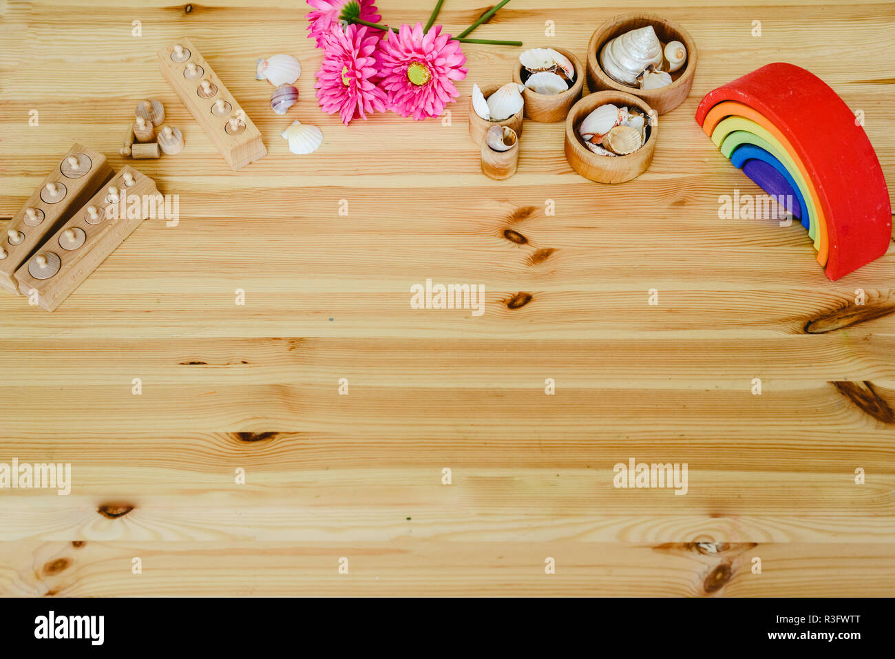 Group of learning materials of round and wooden colors on wooden table ...