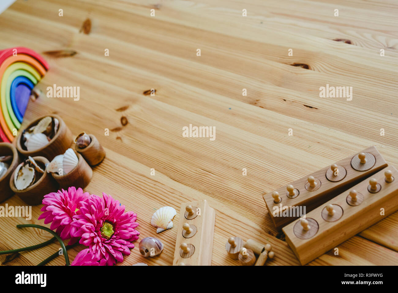 Group of learning materials of round and wooden colors on wooden table ...