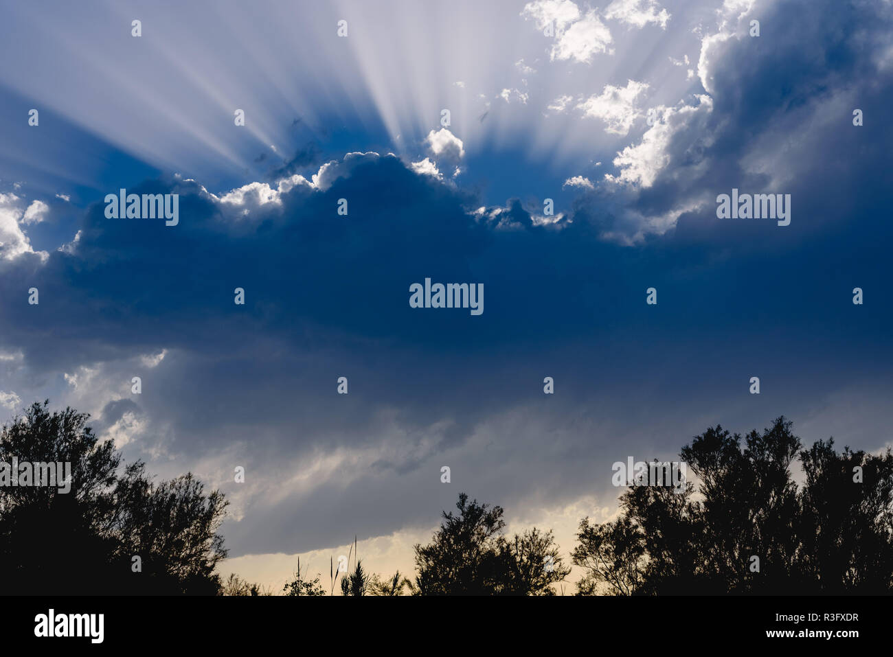 Blue sky very saturated with sun rays Stock Photo - Alamy