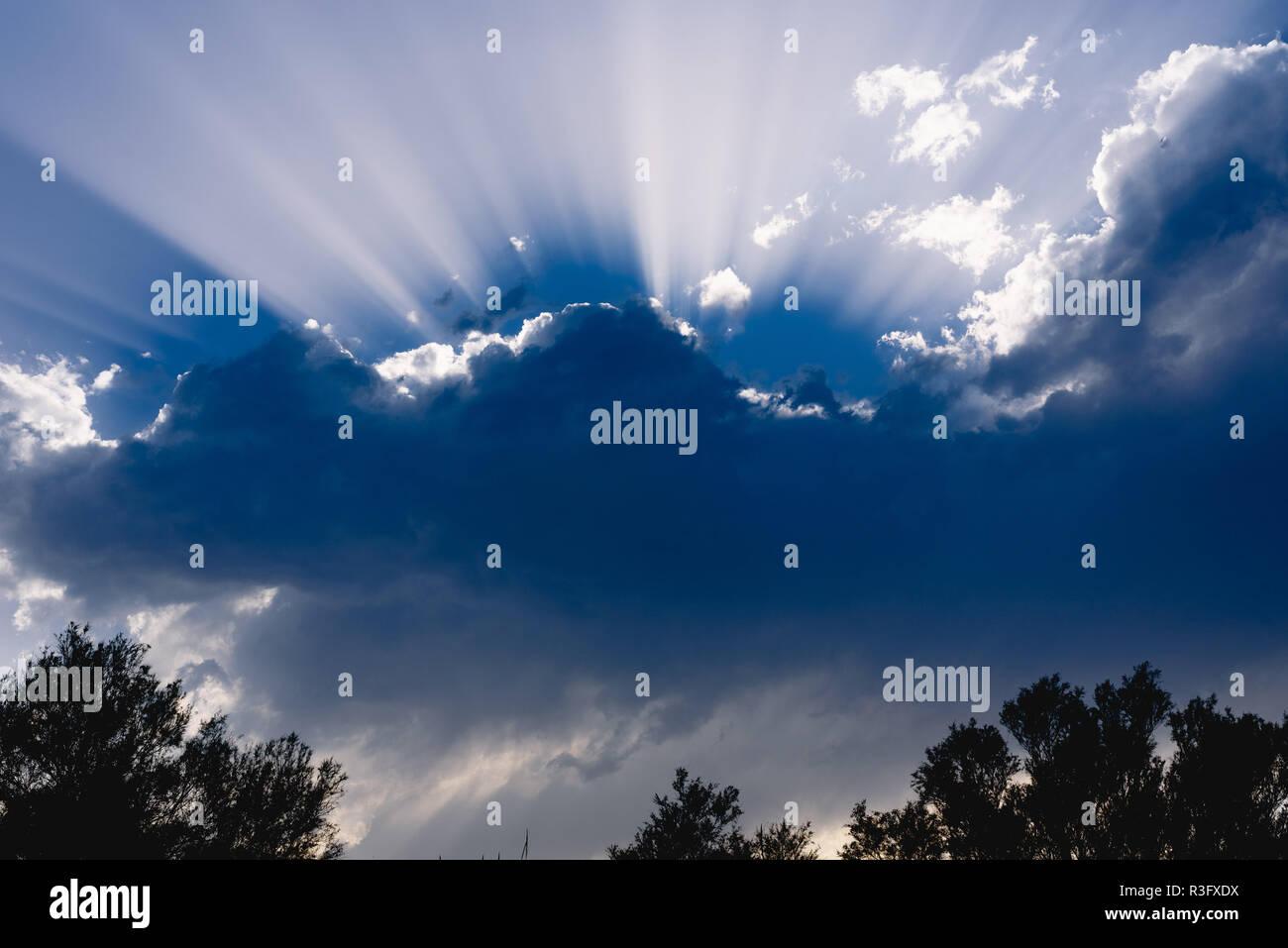 Blue sky very saturated with sun rays Stock Photo - Alamy