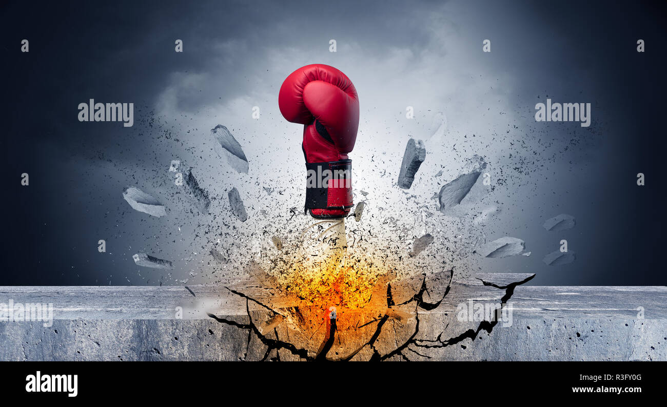 Big hand hits intense and breaks a crass stonewall Stock Photo - Alamy