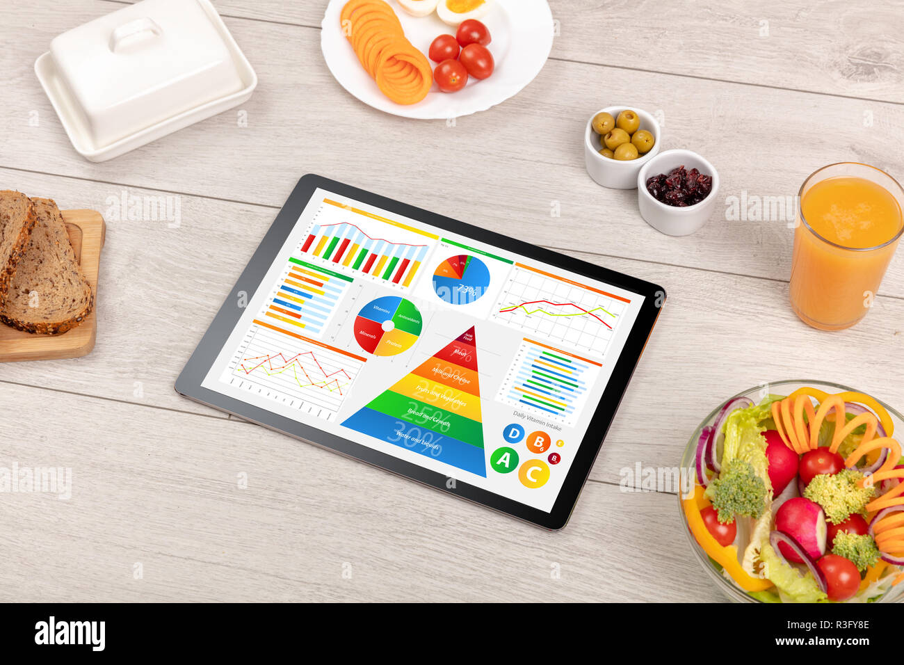 healthy eating concept - close up of tablet with several dieting ...