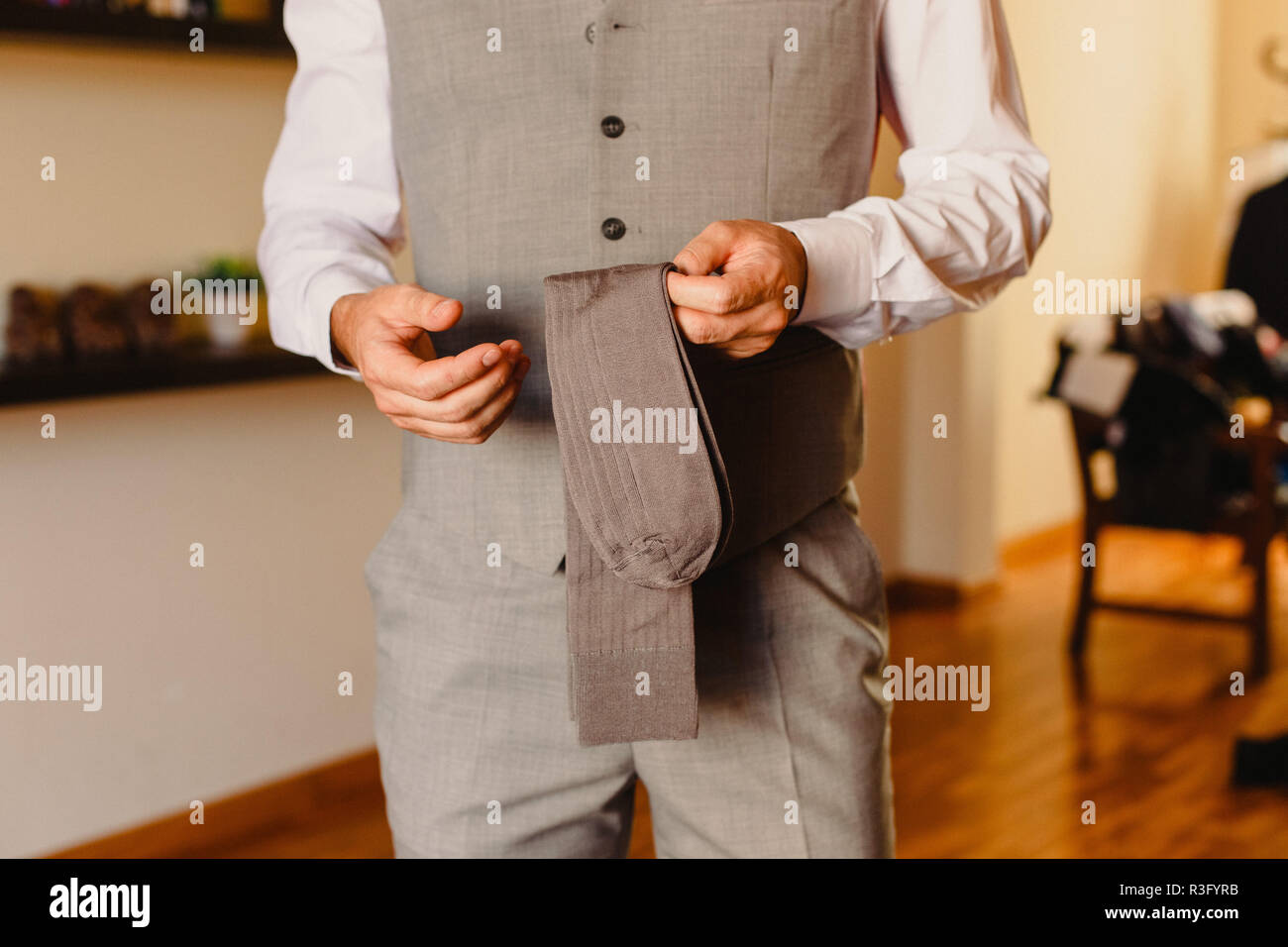 Man dressing in a suit Stock Photo - Alamy