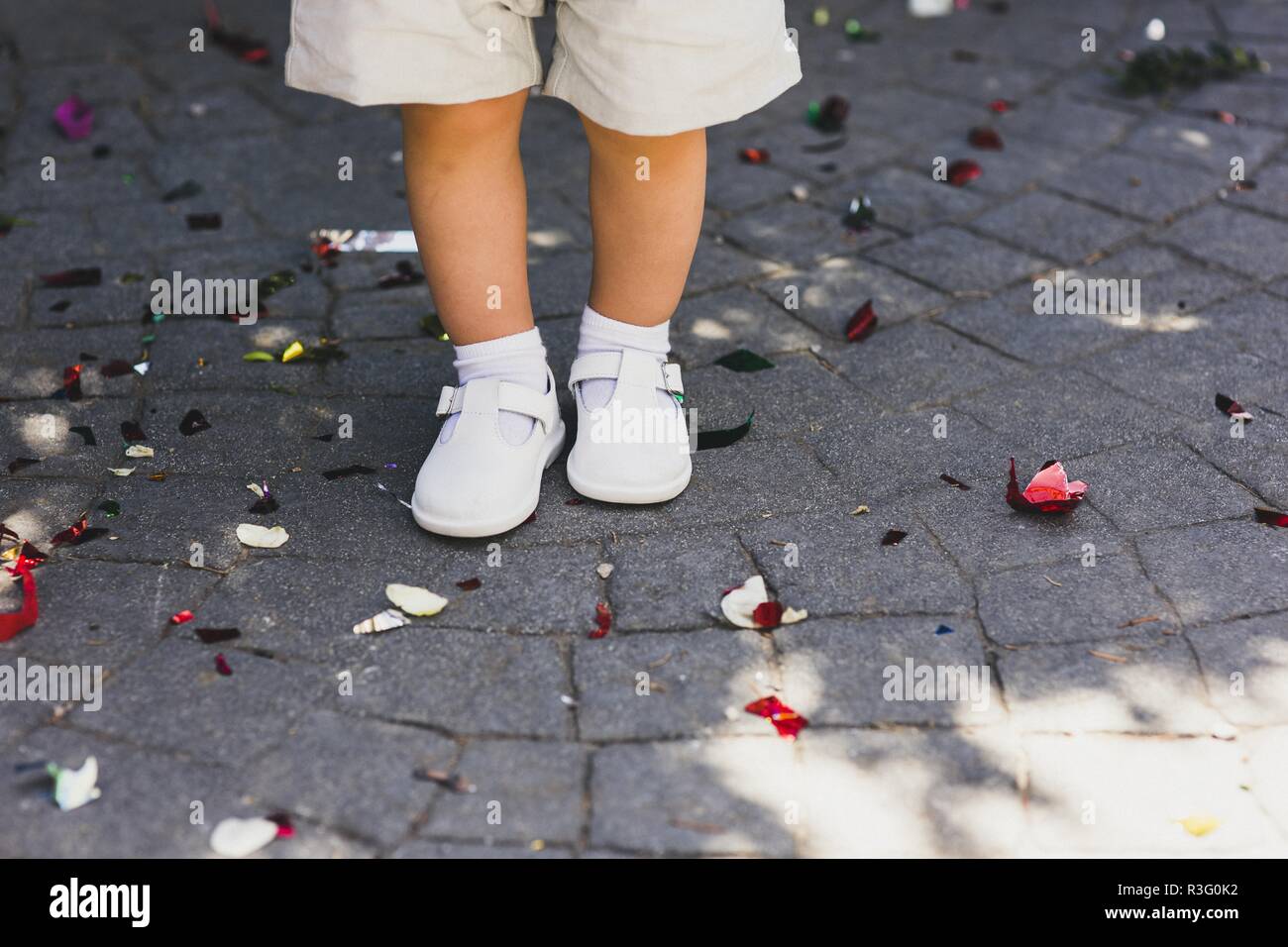 Feet and legs of children playing Stock Photo - Alamy
