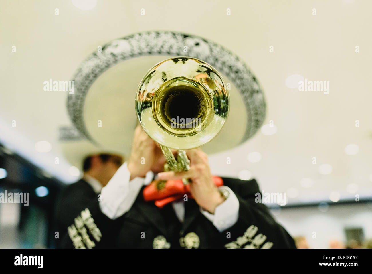Mexican musician with his trumpet and guitars Stock Photo - Alamy