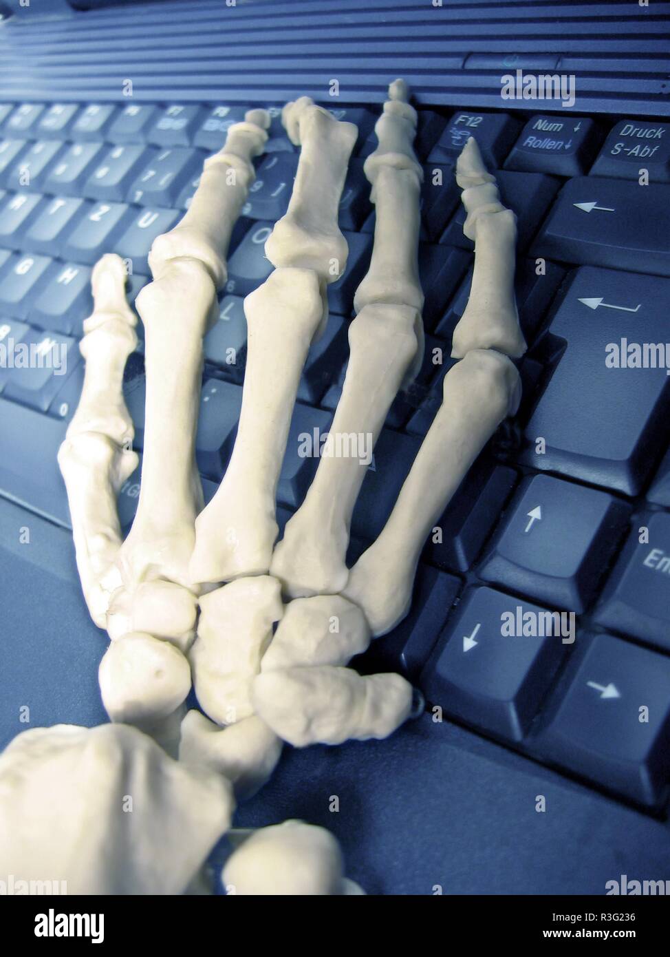 Skeleton hand computer keyboard hi-res stock photography and images - Alamy