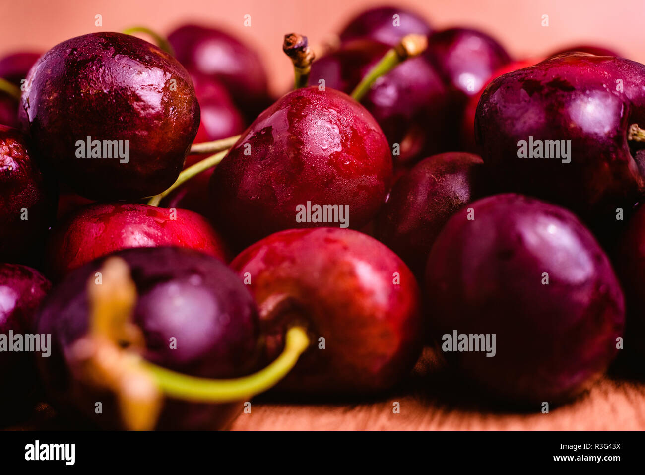 Closeup round sweet red cherries, Summertime Stock Photo - Alamy