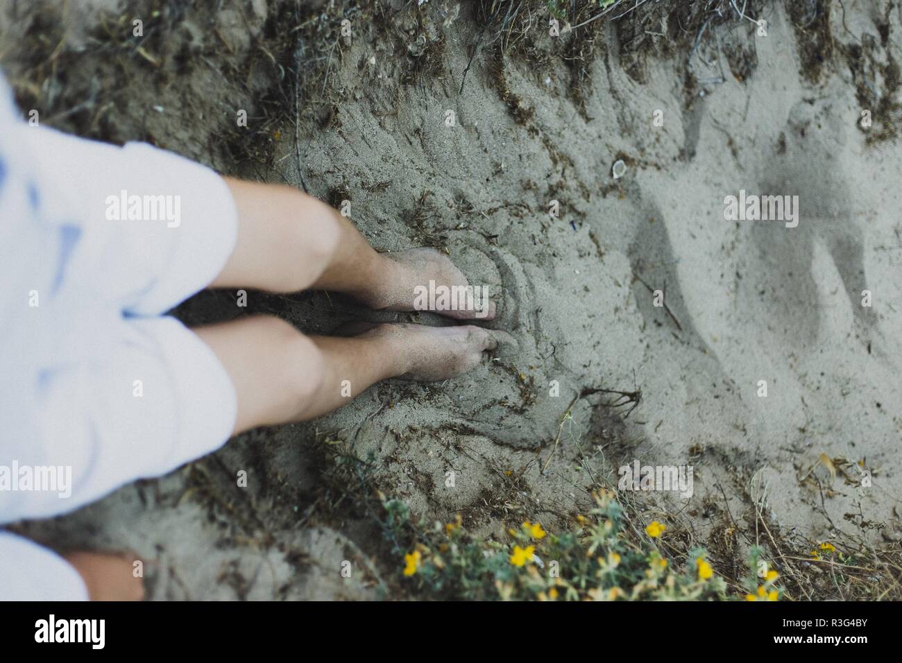 Feet and legs of children playing Stock Photo - Alamy