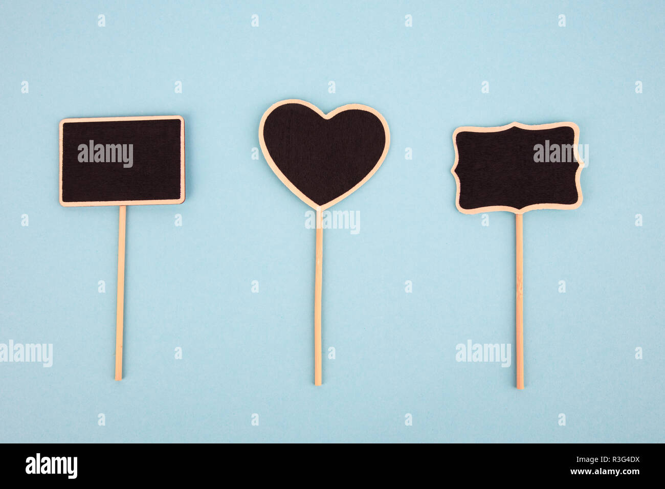 Three little Chalkboards isolated on light blue background Stock Photo ...