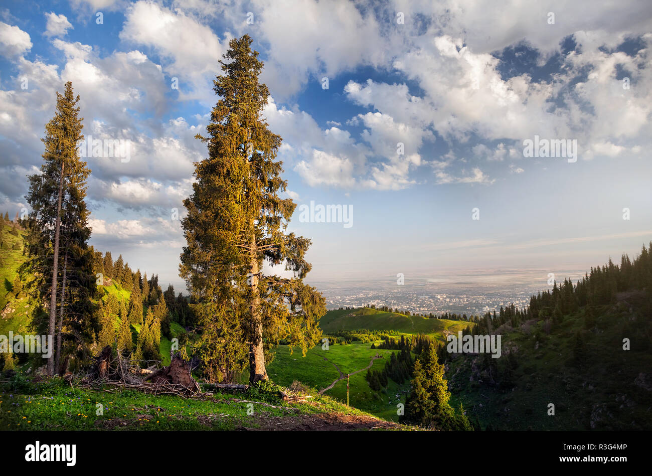 Mountain scenery with Almaty city view at blue sky in Kazakhstan Stock ...