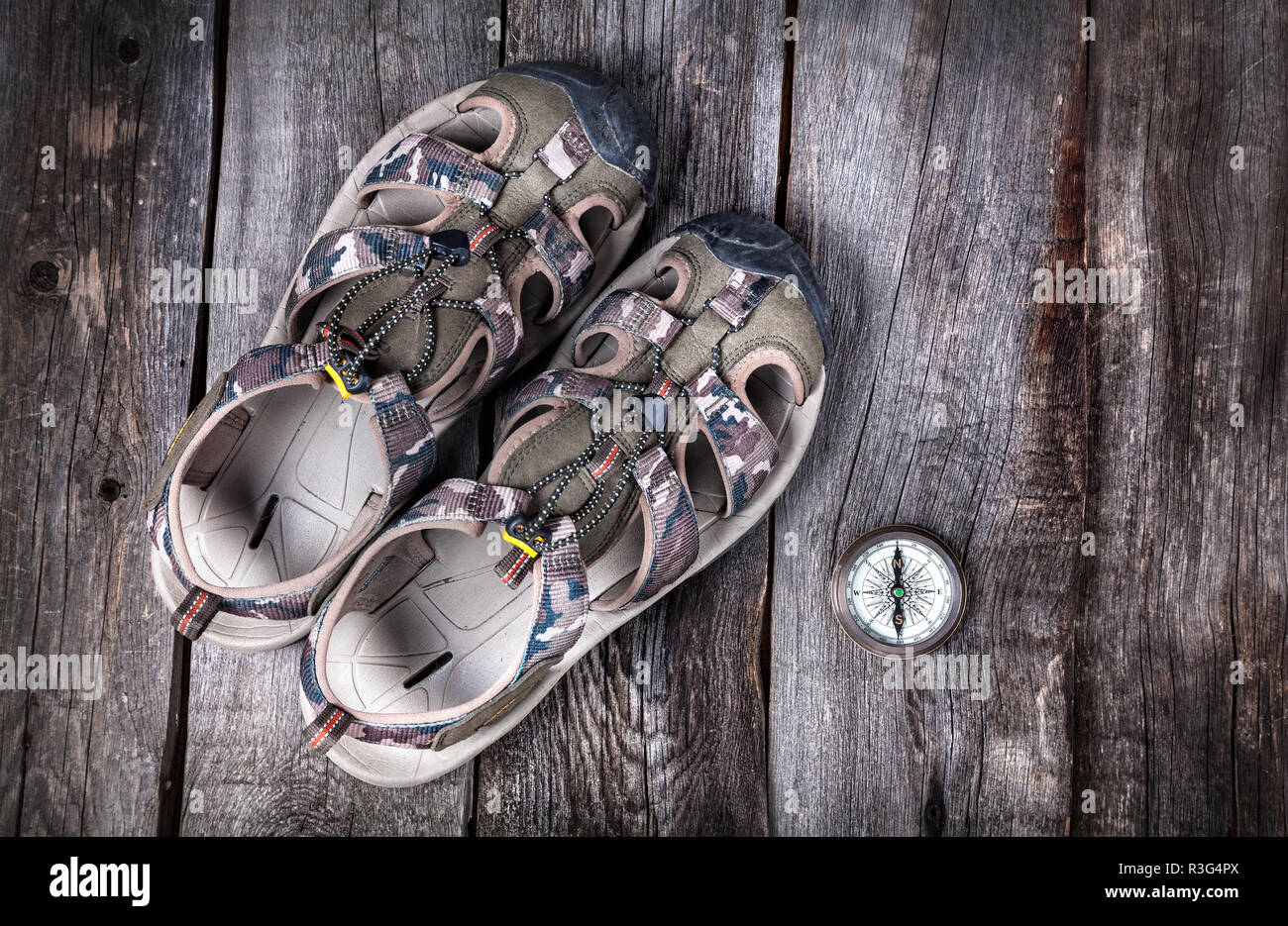 Shoes and compass traveler outfit on the wooden background Stock Photo ...