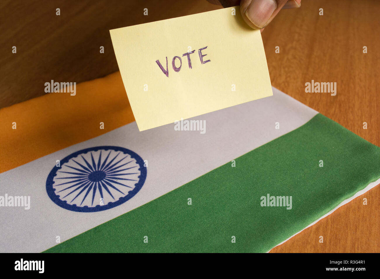 Voting concept - Person holding Hand Written Voting Sticker on India ...