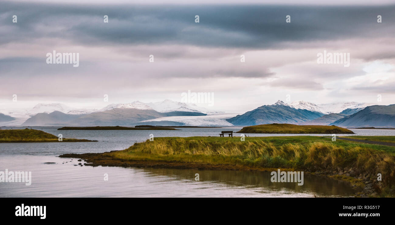 Icelandic landscapes full of green grass, sea and blue sky Stock Photo ...