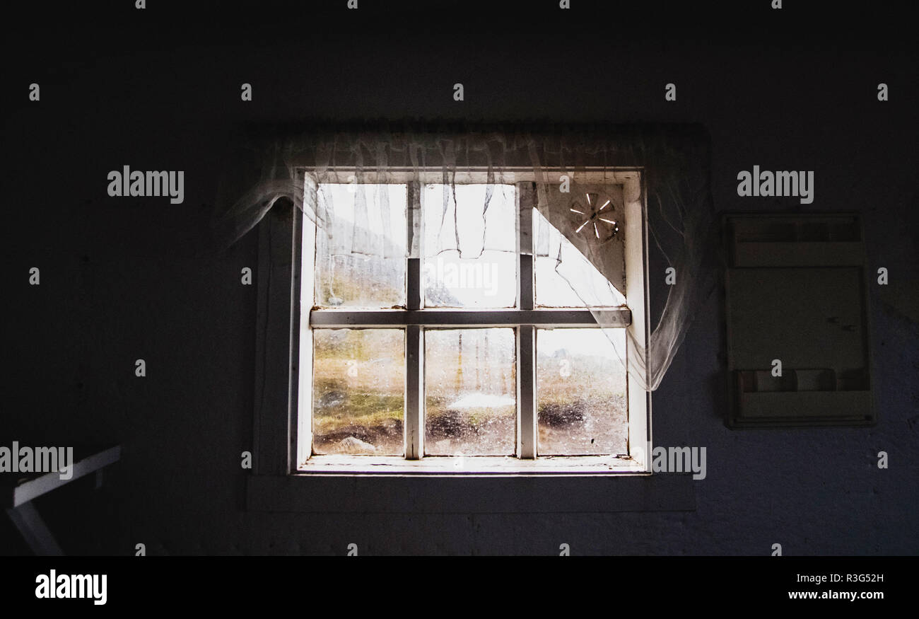 Looking through broken old window Stock Photo - Alamy