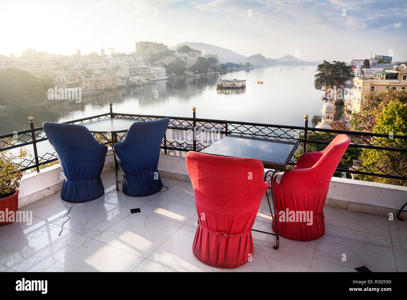Roof top restaurant with beautiful view to Lake Pichola in the morning ...
