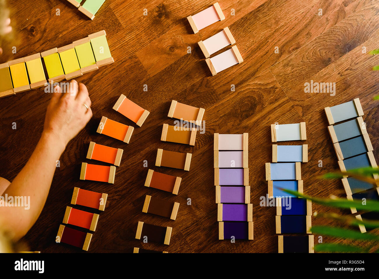 Children playing and learning with montessori color tablets Stock Photo ...