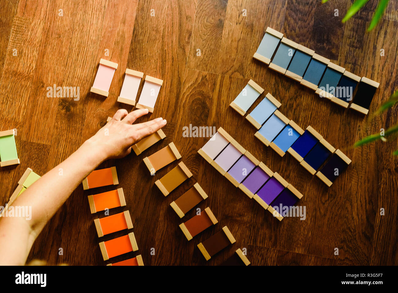 Children playing and learning with montessori color tablets Stock Photo ...