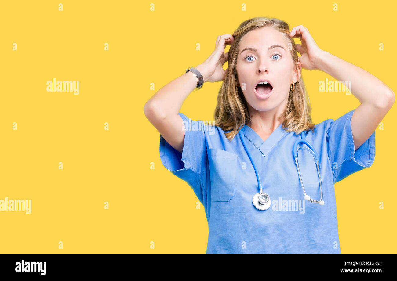 Beautiful young doctor woman wearing medical uniform over isolated ...