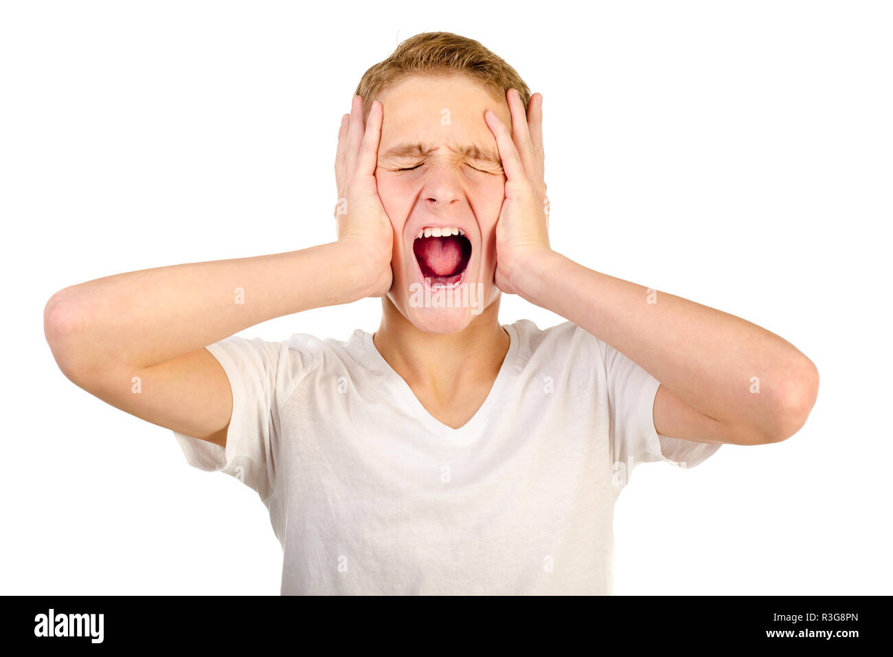 screaming teenage boy isolated on a white background Stock Photo - Alamy