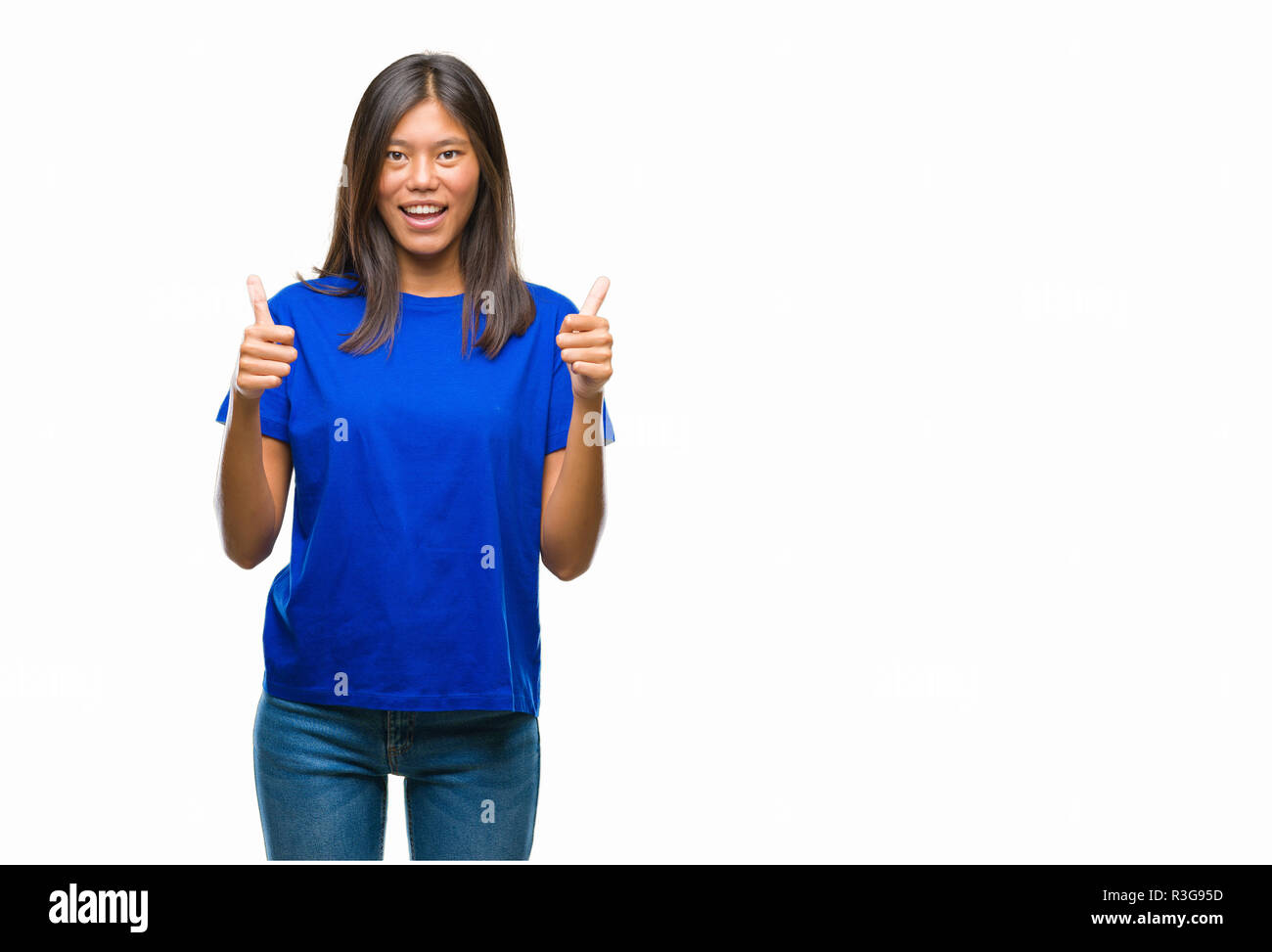 Young asian woman over isolated background success sign doing positive ...