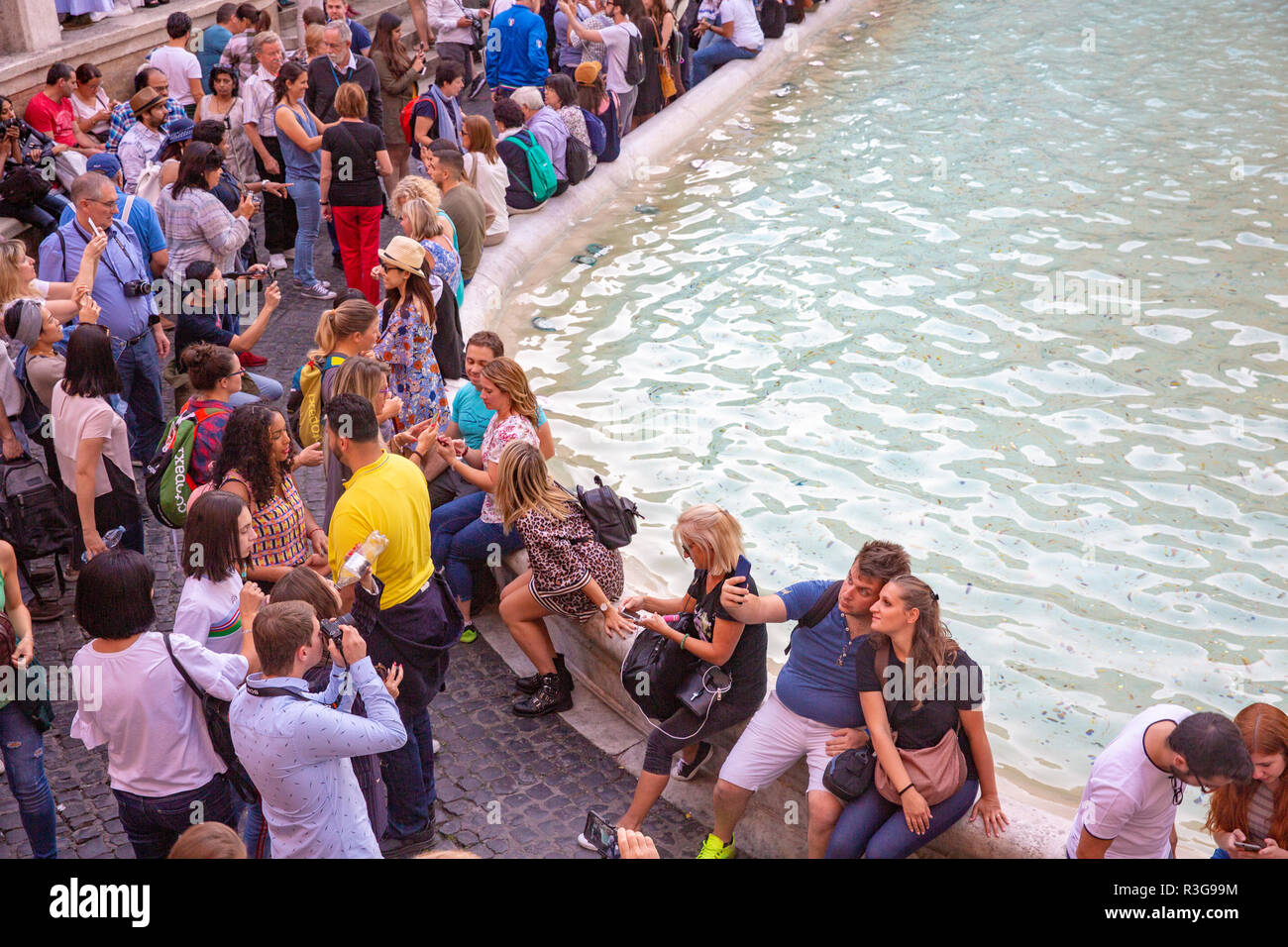 Tourists crowd around the Trevi fountain in the centre of Rome,Lazio ...