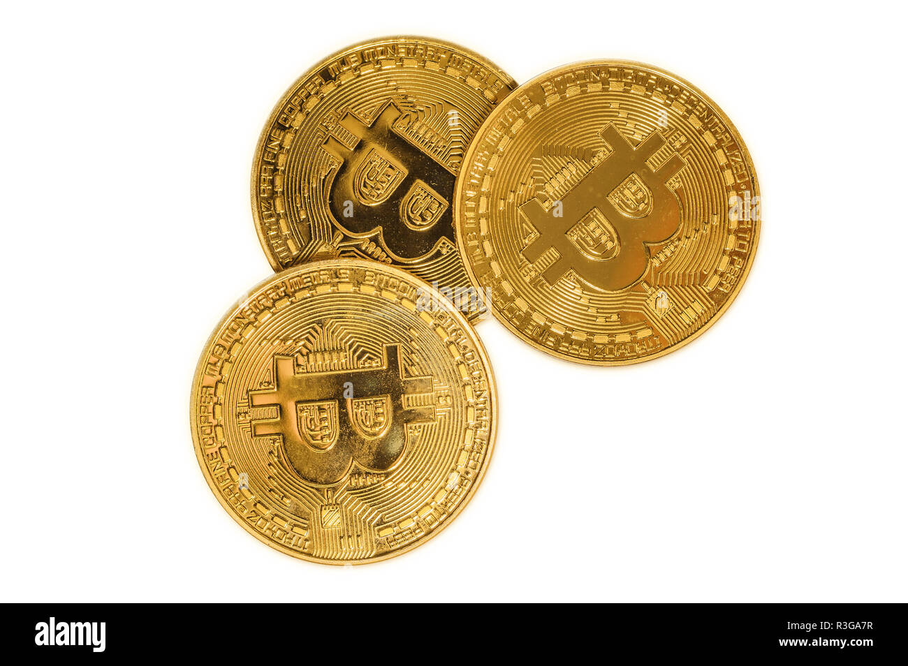 three golden bitcoin coin closeup with BIT symbol. Isolated on white ...