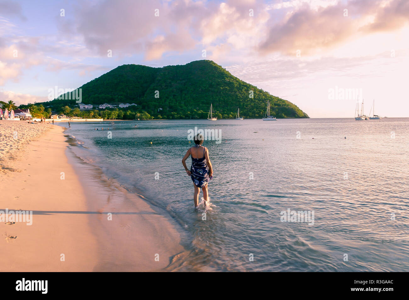REDUIT BEACH, ST LUCIA - JUNE 09 2007: Holiday makers enjoying the sun ...
