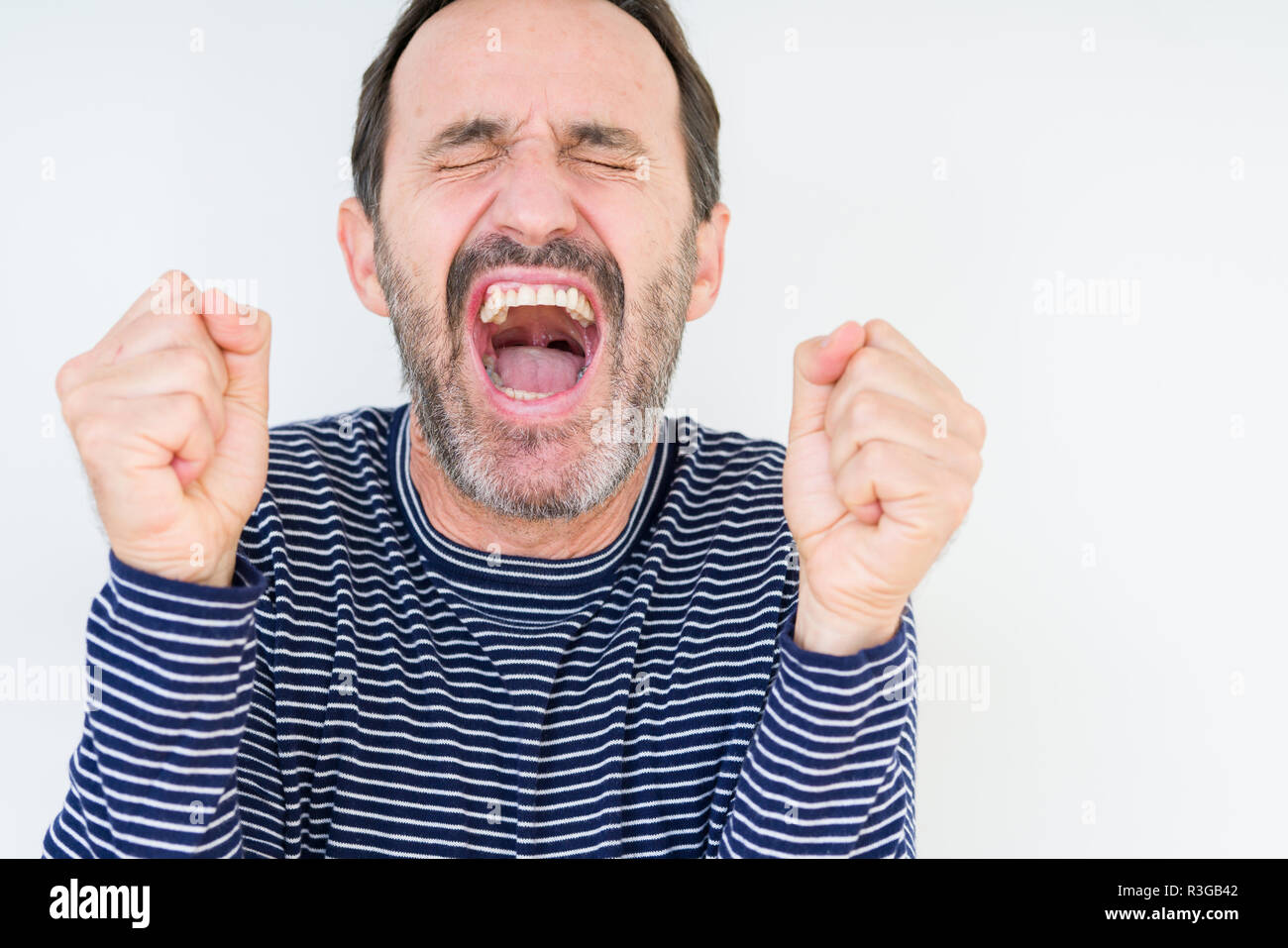 Handsome senior man over isolated background celebrating mad and crazy ...