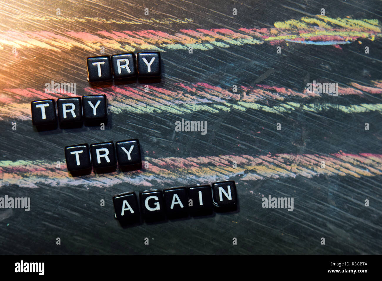 Try Try Try Again on wooden blocks. Cross processed image with ...