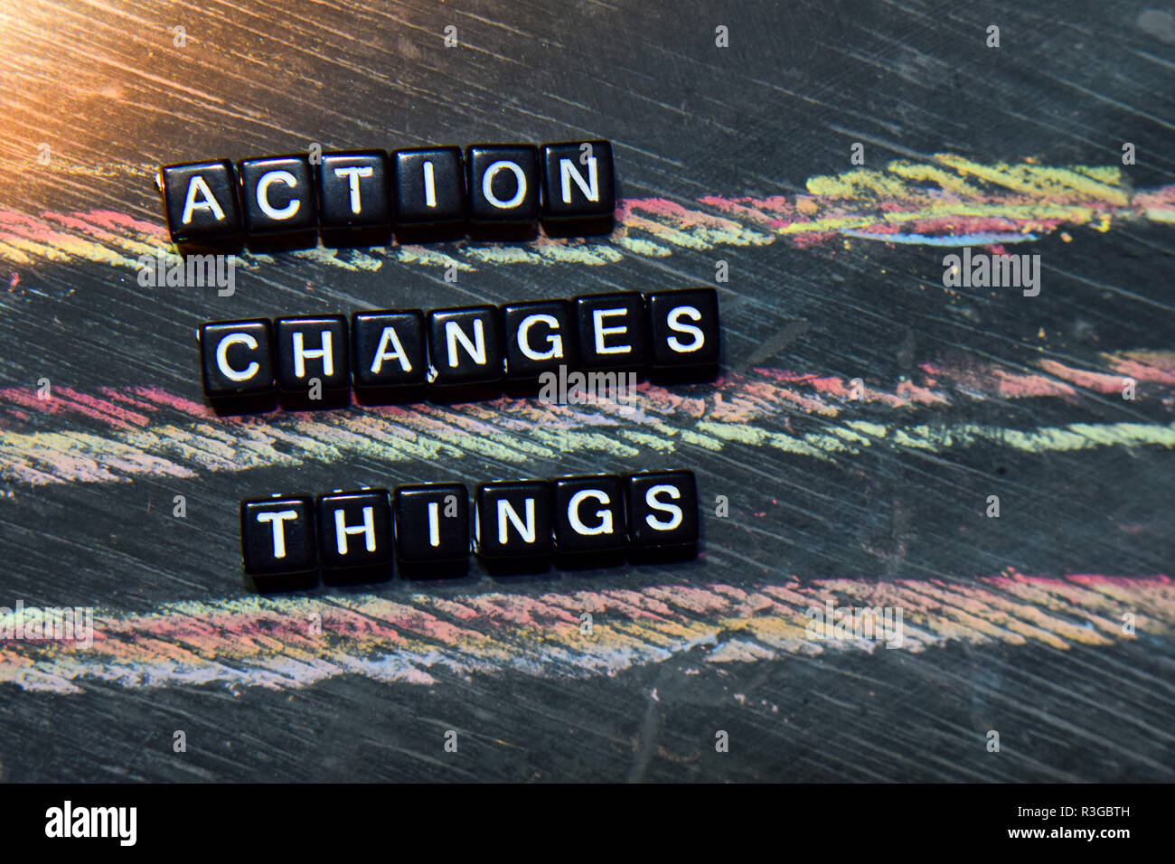 Action Changes Things - ACT on wooden blocks. Cross processed image ...