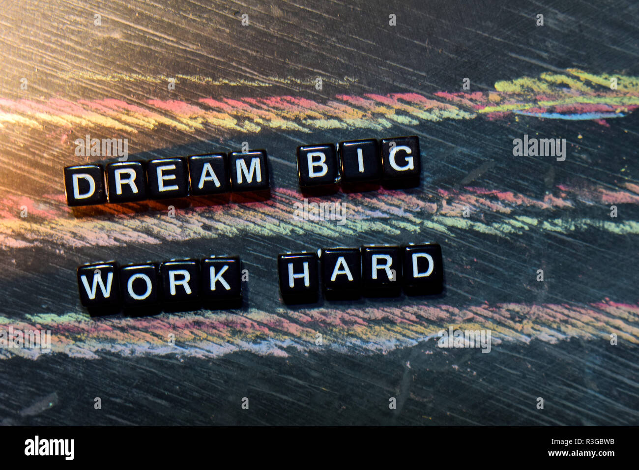 Dream Big Work Hard on wooden blocks. Cross processed image with ...
