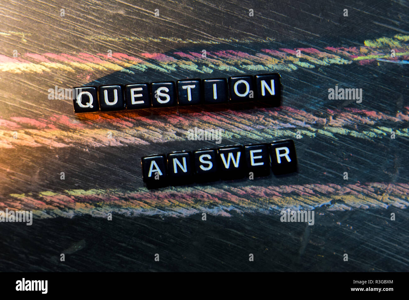 Question Answer on wooden blocks. Cross processed image with blackboard ...