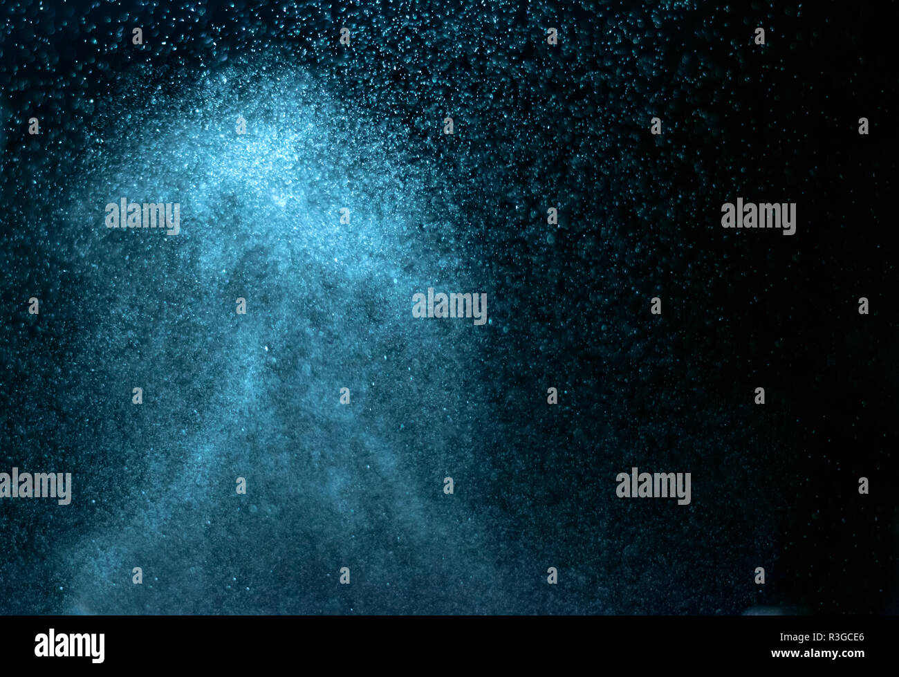 Water jet spraying on black background Stock Photo - Alamy