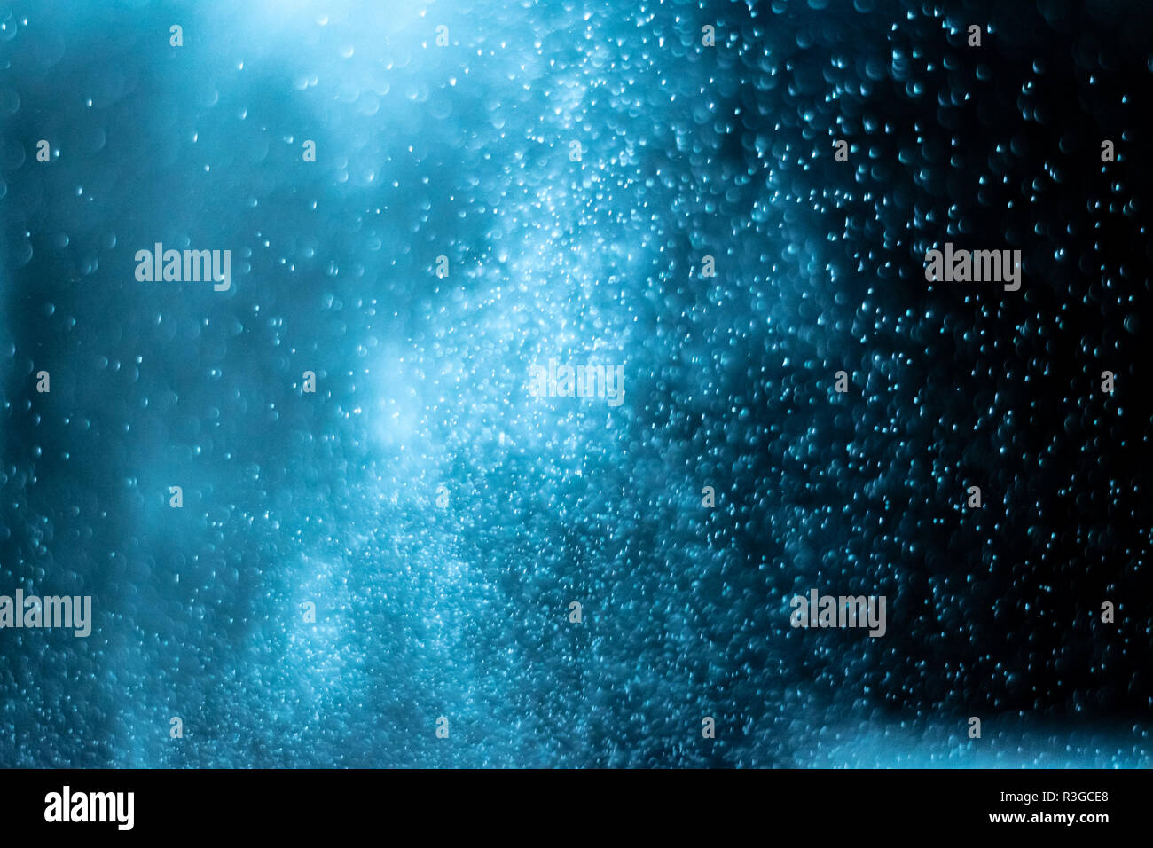 Water jet spraying on black background Stock Photo - Alamy