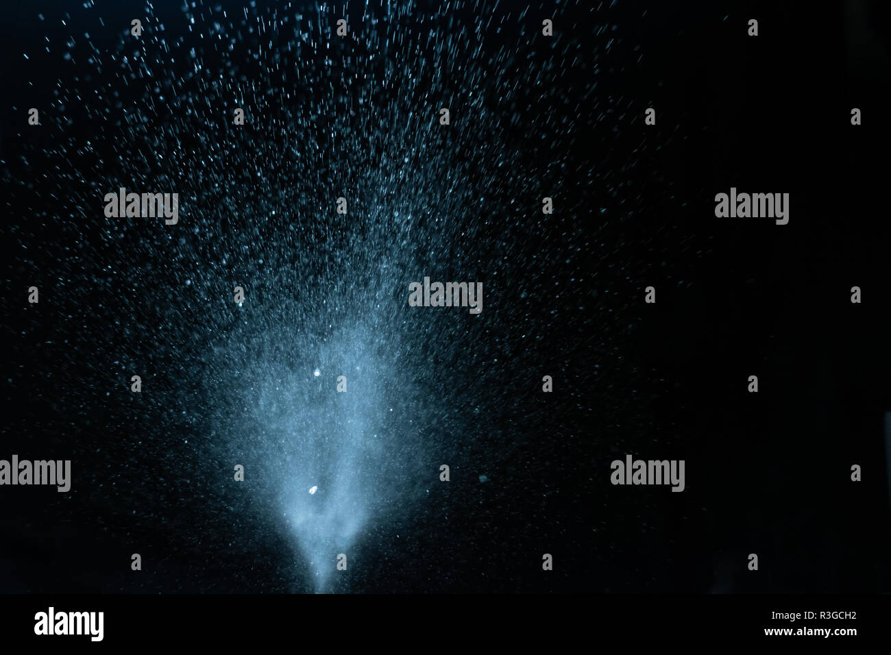 Water jet spraying on black background Stock Photo - Alamy