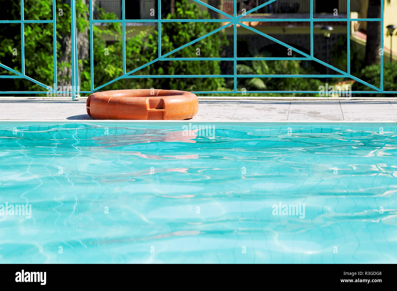 A life buoy for safety on the edge of pool Stock Photo - Alamy
