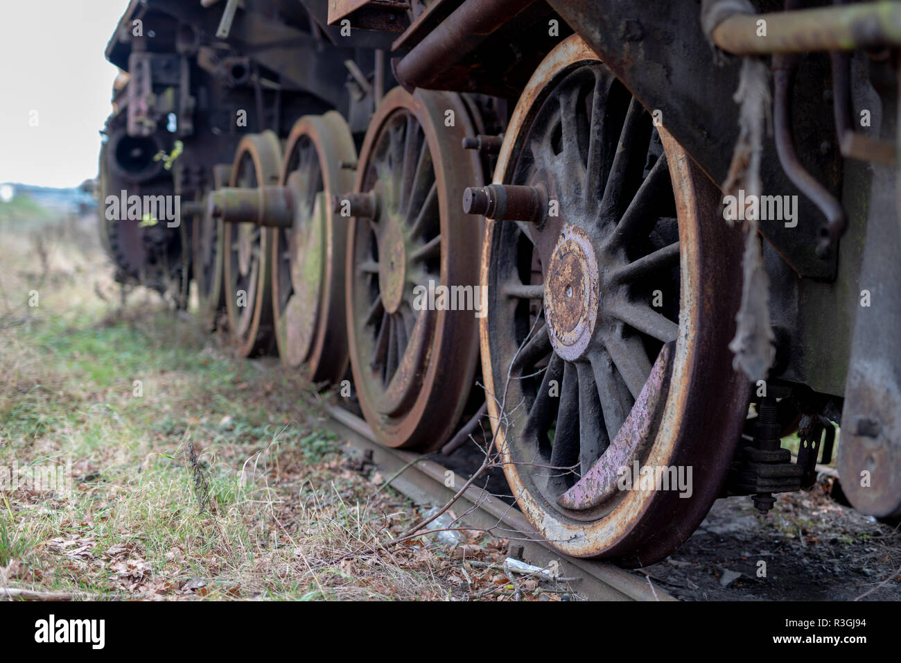 Old destroyed steam engines. Forgotten railway station in central ...