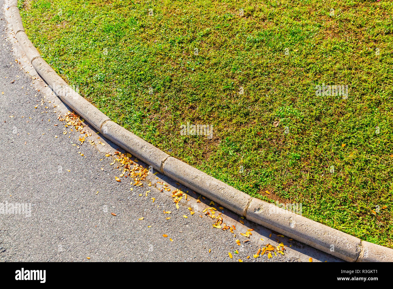 picture of a channeling island with lawn and a road Stock Photo - Alamy
