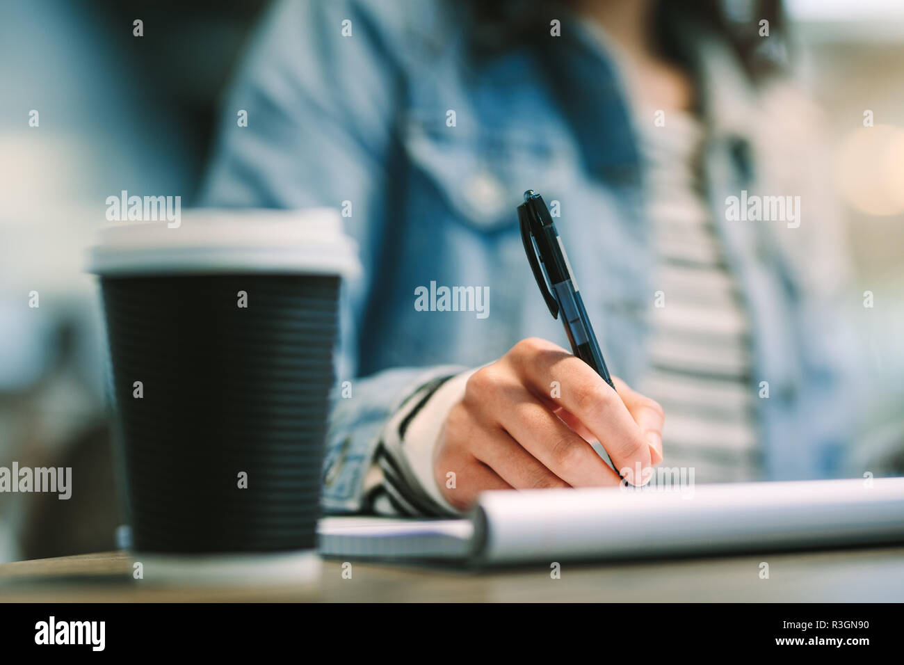 Closeup young student making notes hi-res stock photography and images ...