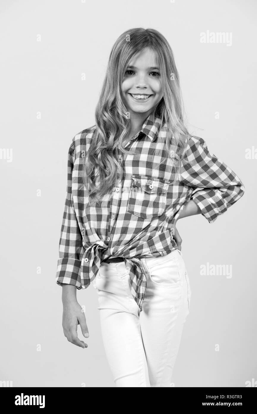 Pretty little girl smile on orange background Stock Photo - Alamy