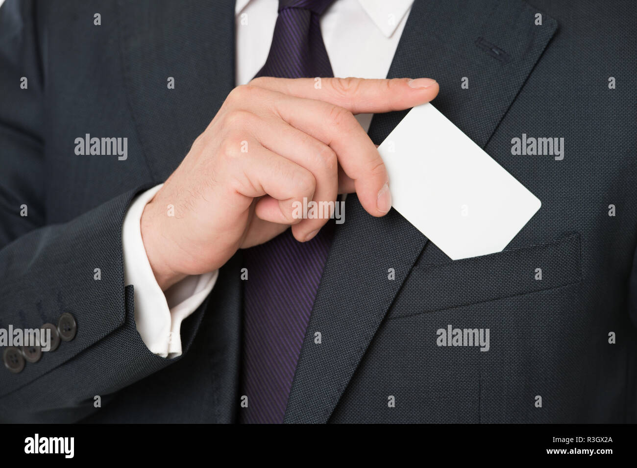 Custom debit card design. Male hand put plastic blank white card to ...