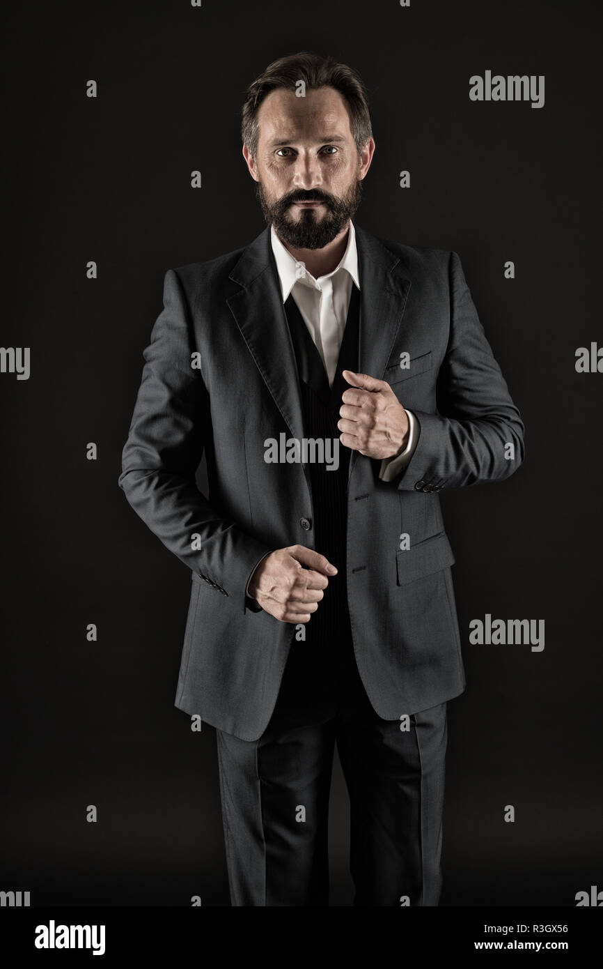 Feeling confident in his style. Businessman classic formal suit hold ...