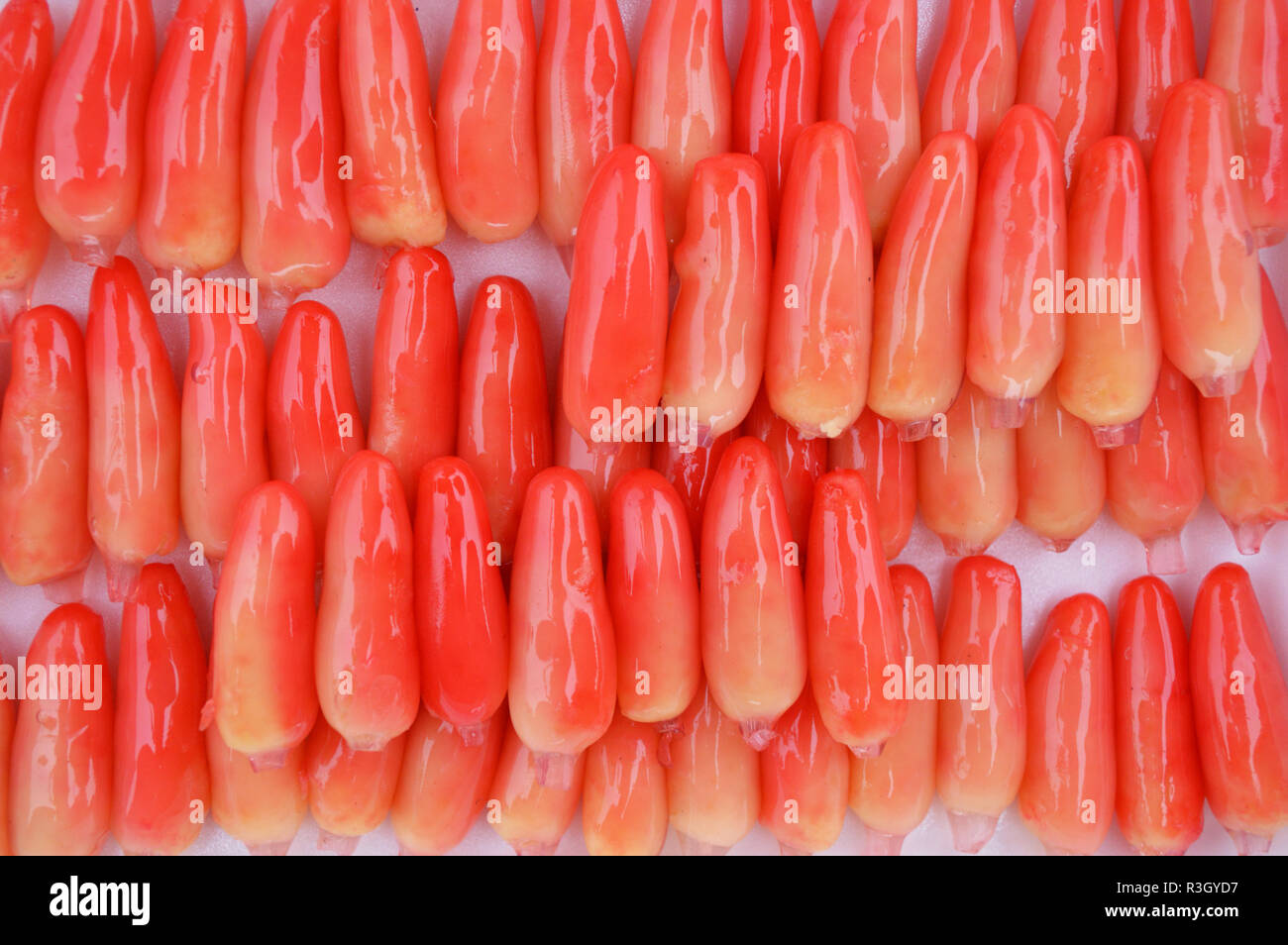 red candy of chilli sweet dessert on white background - fruit shaped ...