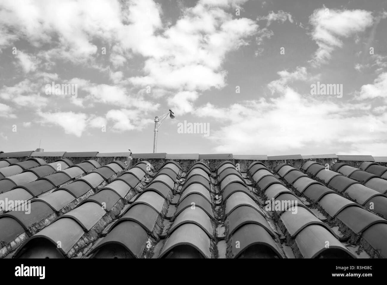 Roof with terracotta tile in miami, usa. Tile roofing on cloudy blue ...