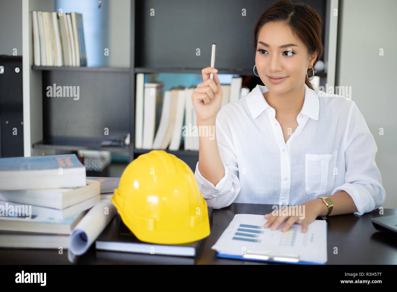 Female engineers are thinking to create new jobs and are smiling and ...